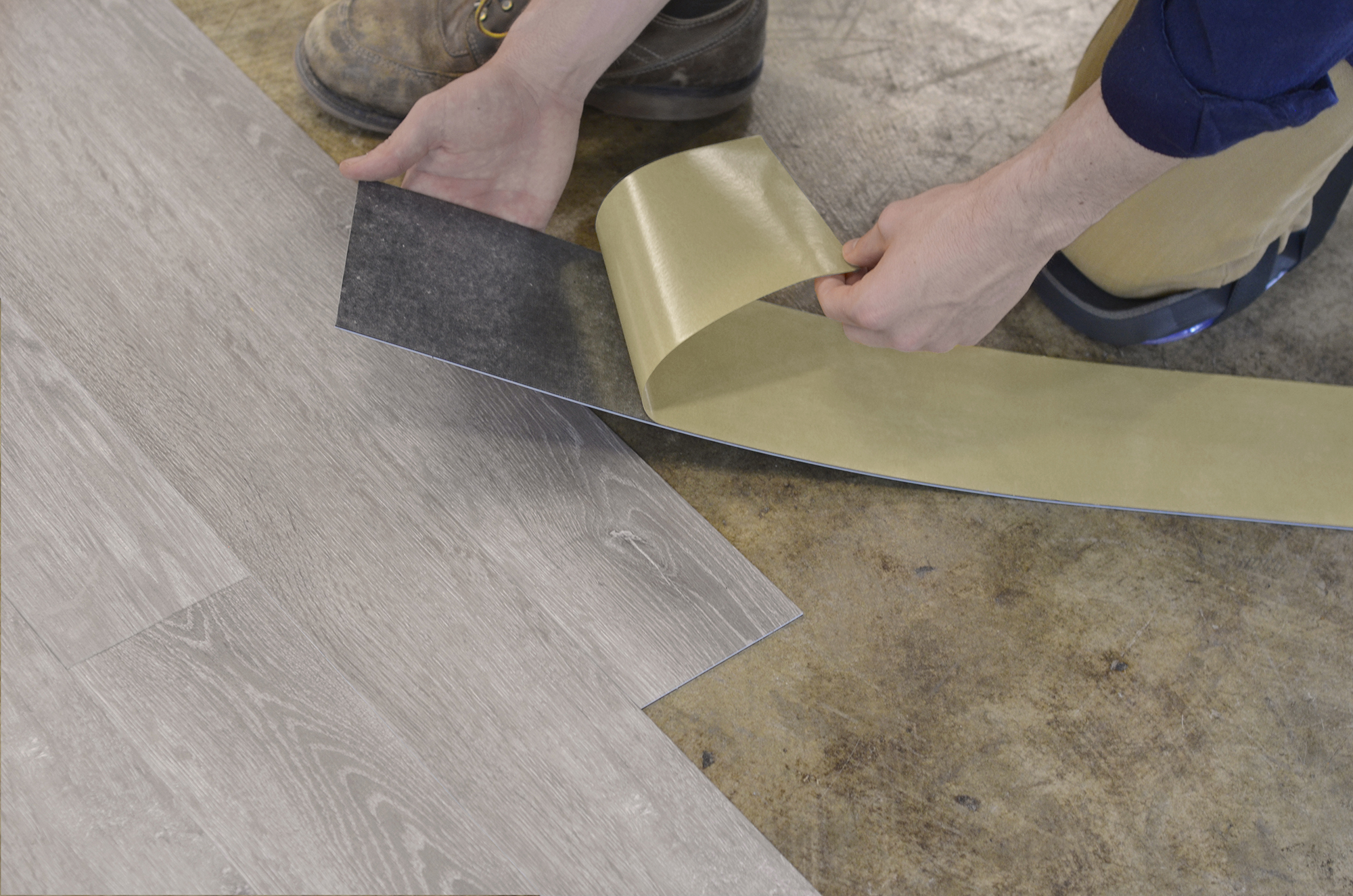 Pre-applied adhesive for LVT - Coverings